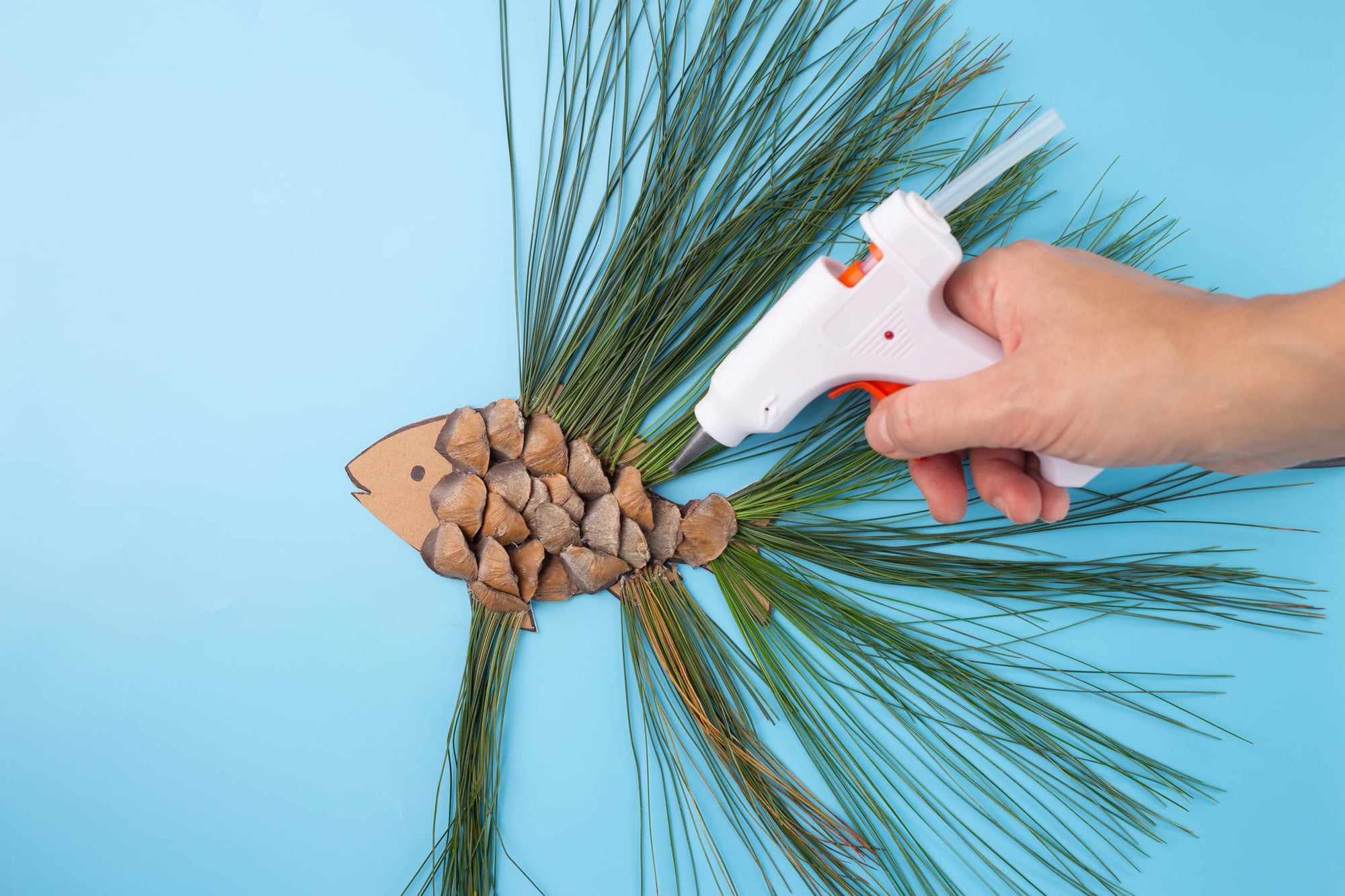 How to make a pine cone fish craft - In The Playroom
